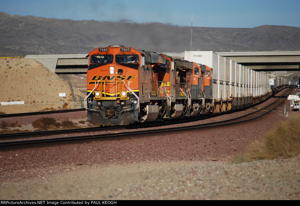 BNSF 7565 Leads a UPS Double Stack Train out of BNSF Barstow towards LA.